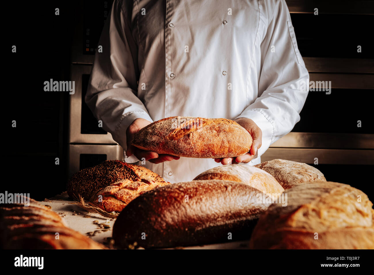 Baker in white jacket hi-res stock photography and images - Alamy