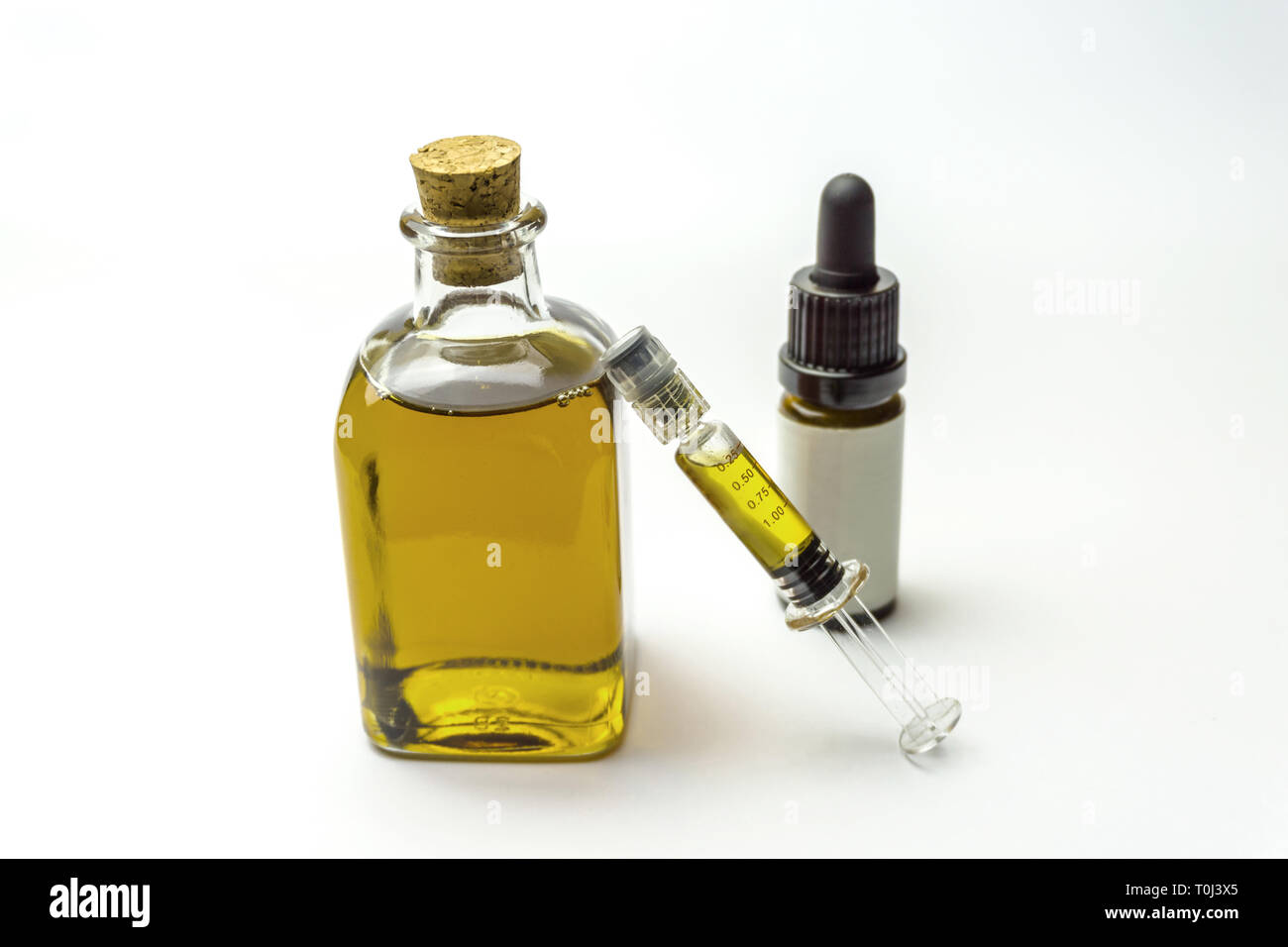 Cbd oil in glass bottles and syringe, isolated on white Stock Photo - Alamy