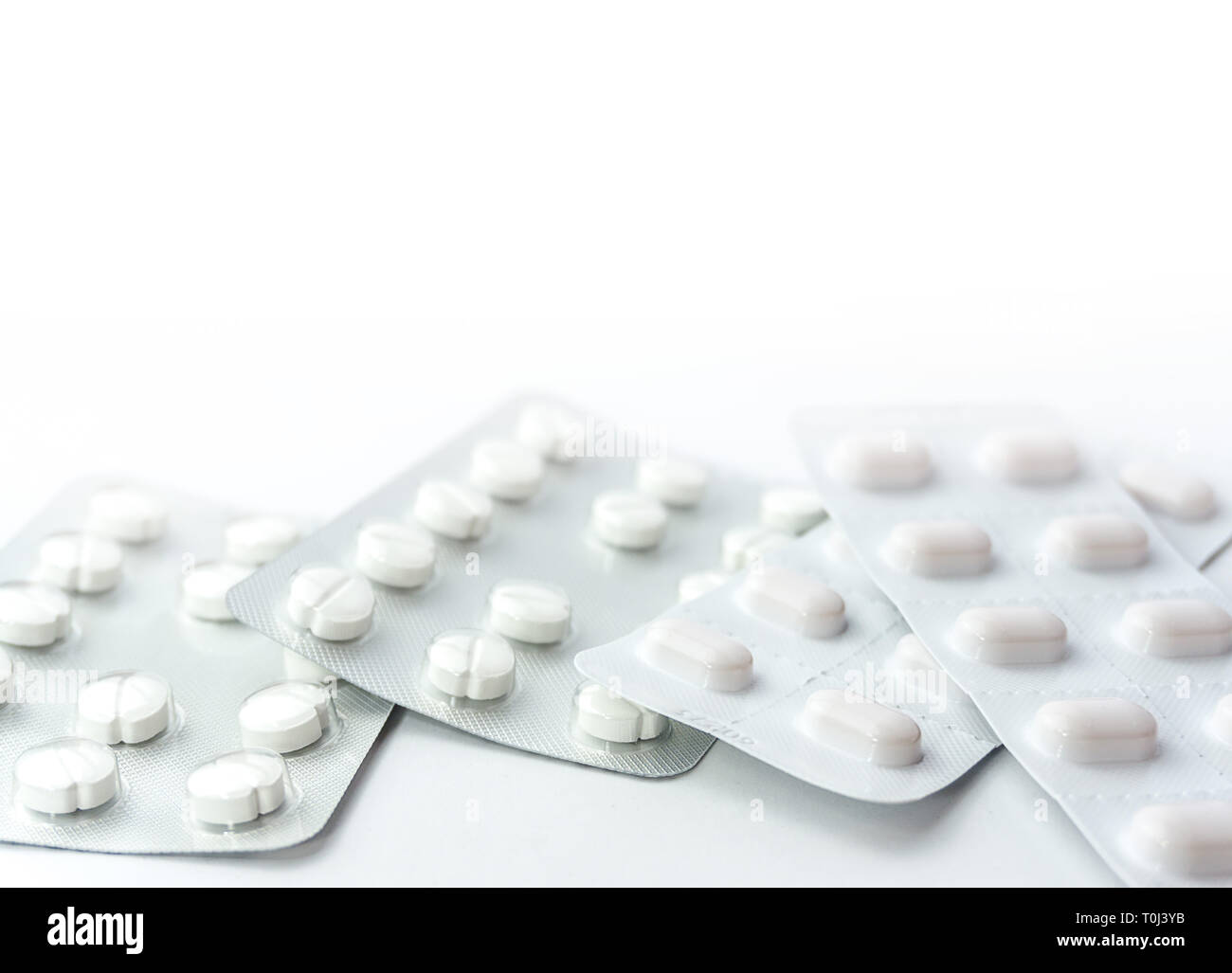Medical pills in silver blister packs isolated on white background ...