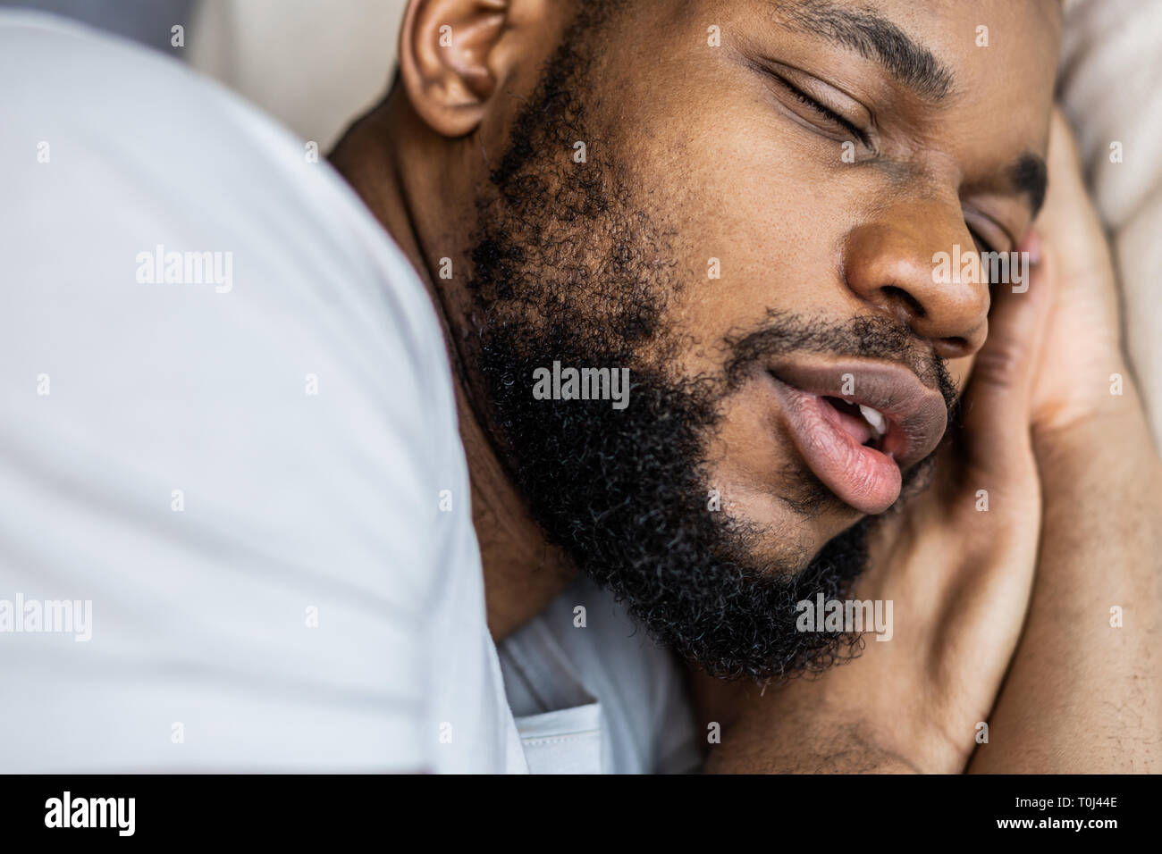 Close up young man sleeping hi-res stock photography and images - Alamy