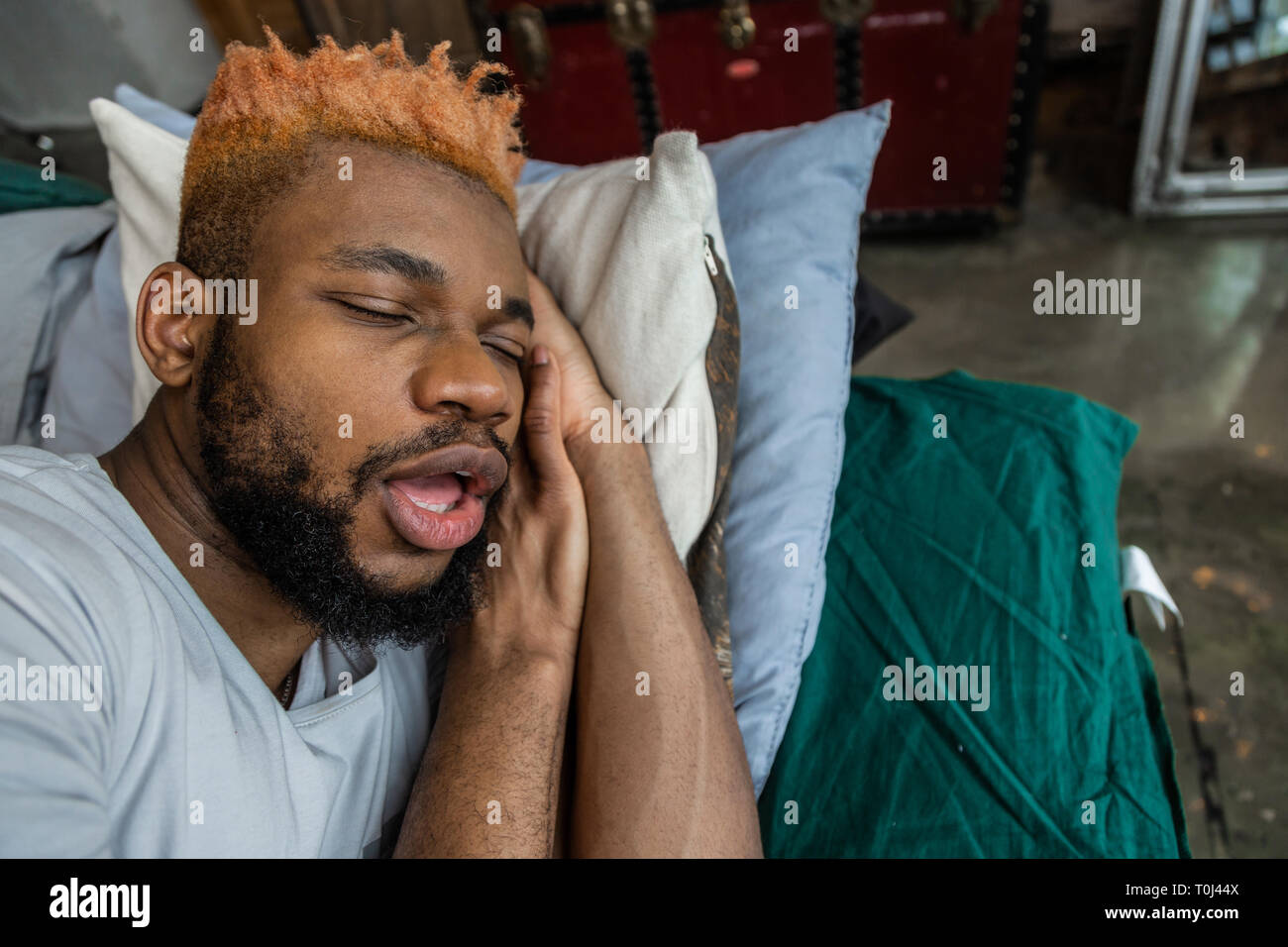Top view of a sleepy young man Stock Photo - Alamy