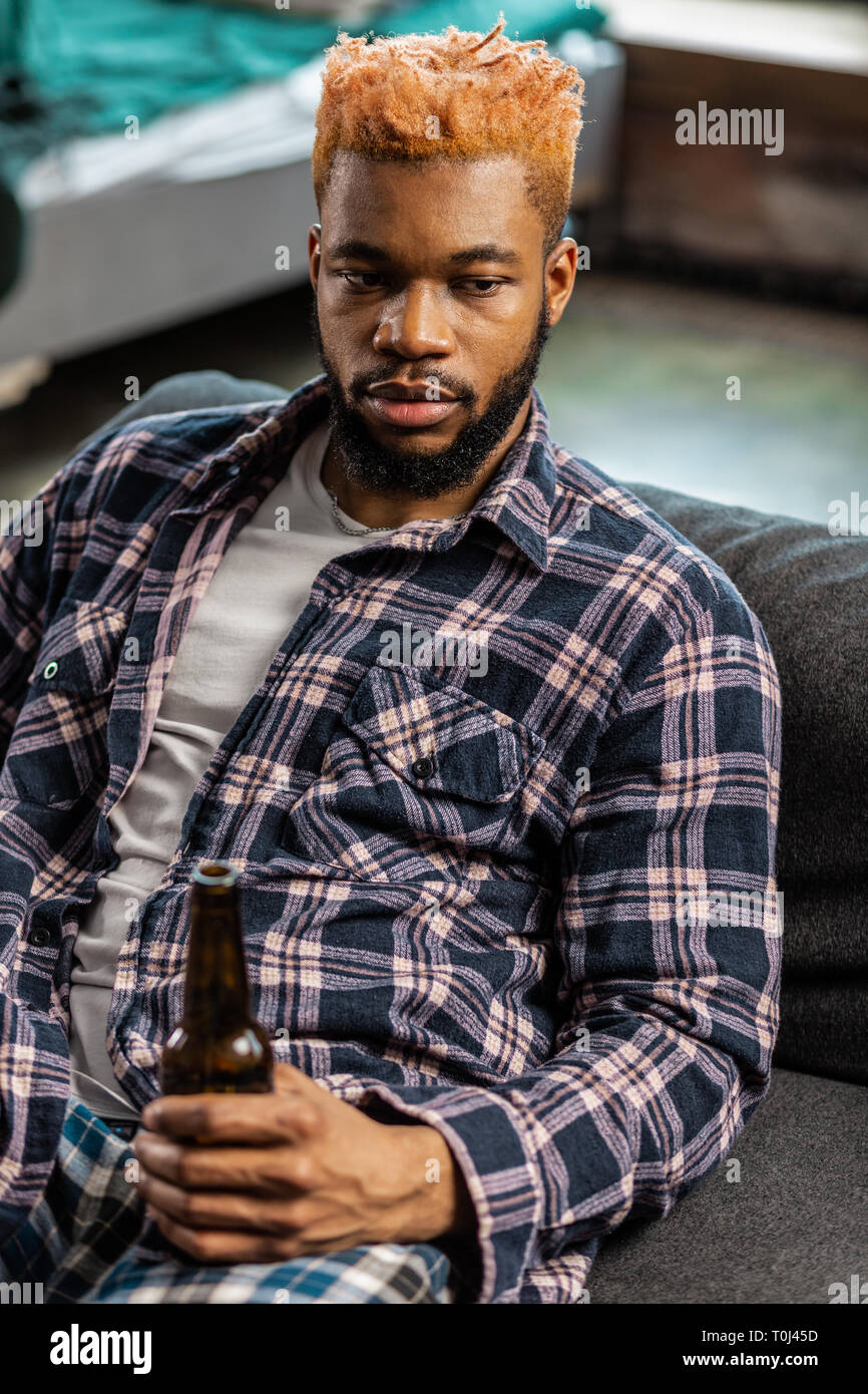 Nice good looking man drinking beer from the bottle Stock Photo - Alamy