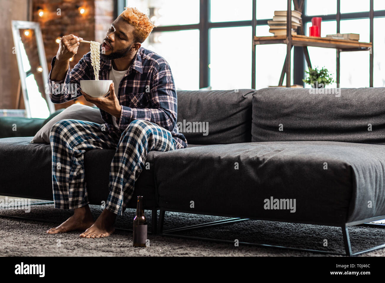 Nice hungry man looking at his noodles Stock Photo - Alamy