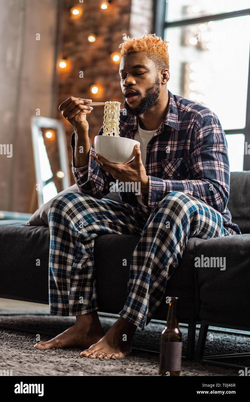 Good looking hungry man having his meal Stock Photo - Alamy