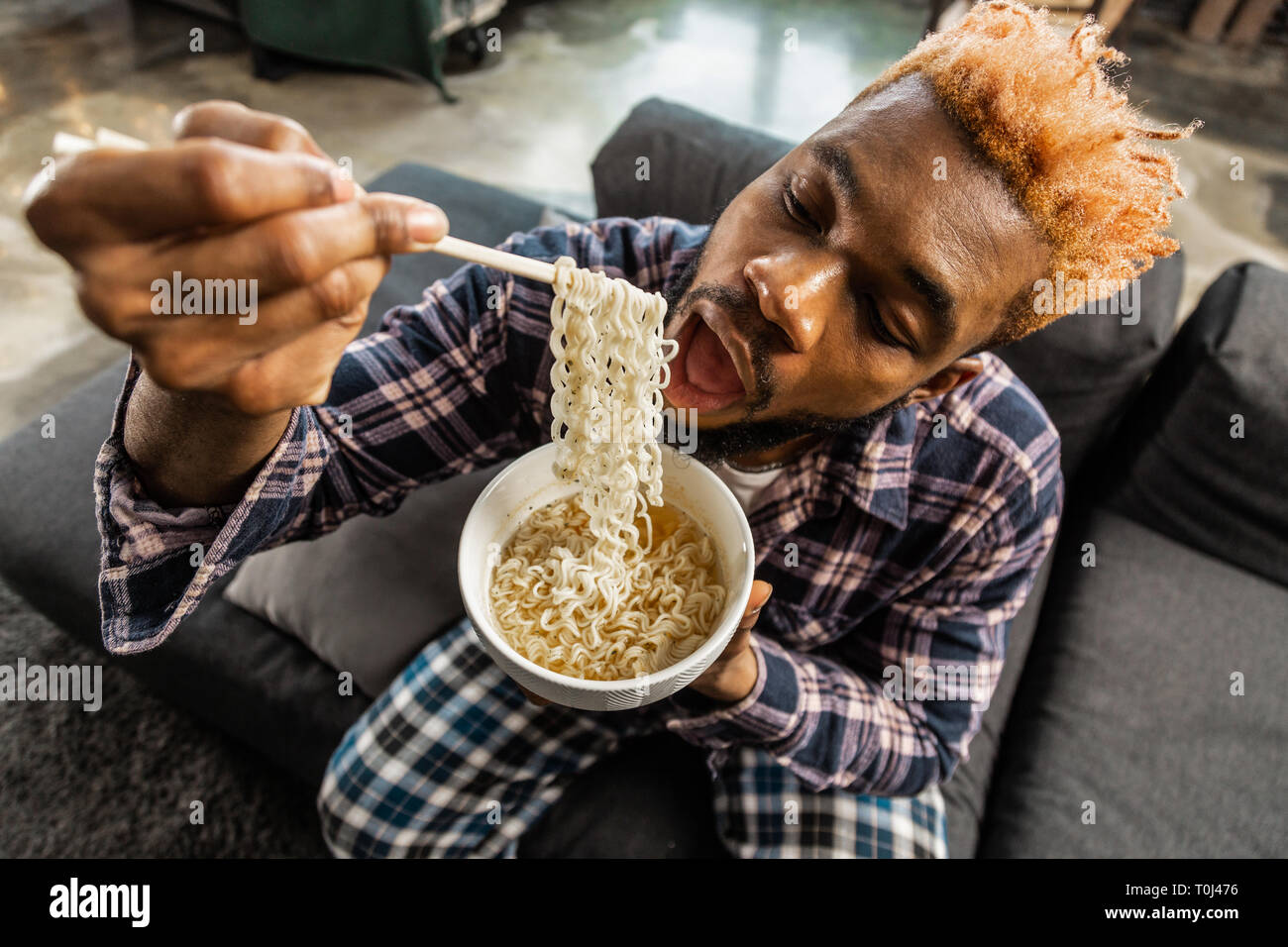 Top view of a hungry young man Stock Photo - Alamy