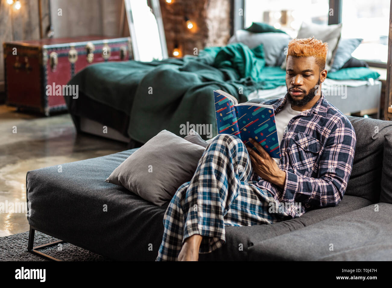 Serious smart man reading hi-res stock photography and images - Alamy