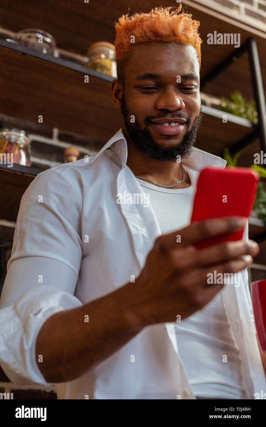 Nice good looking man answering the message Stock Photo - Alamy