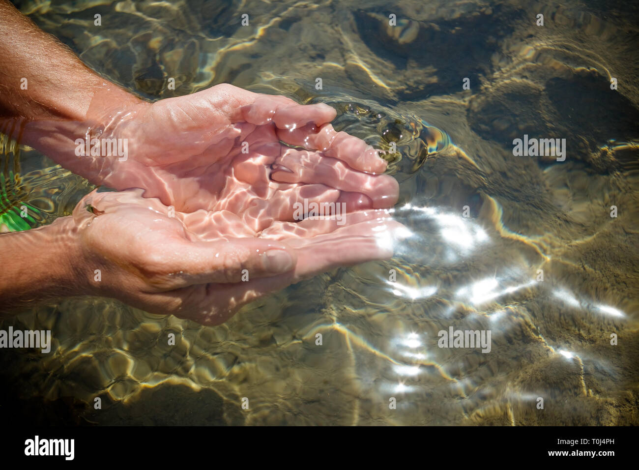 Male hands open in water surface.Save the Planet.Healthy lifestyle ...