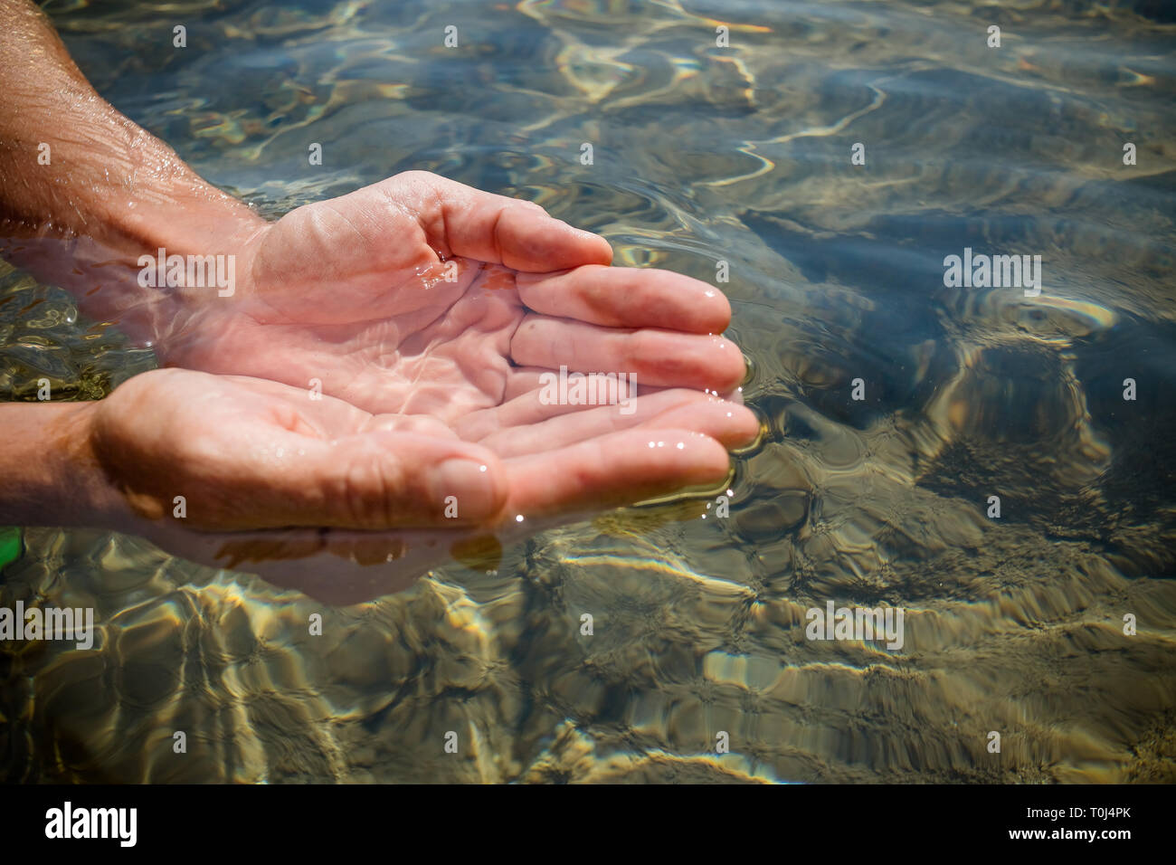 Male hands open in water surface.Save the Planet.Healthy lifestyle ...