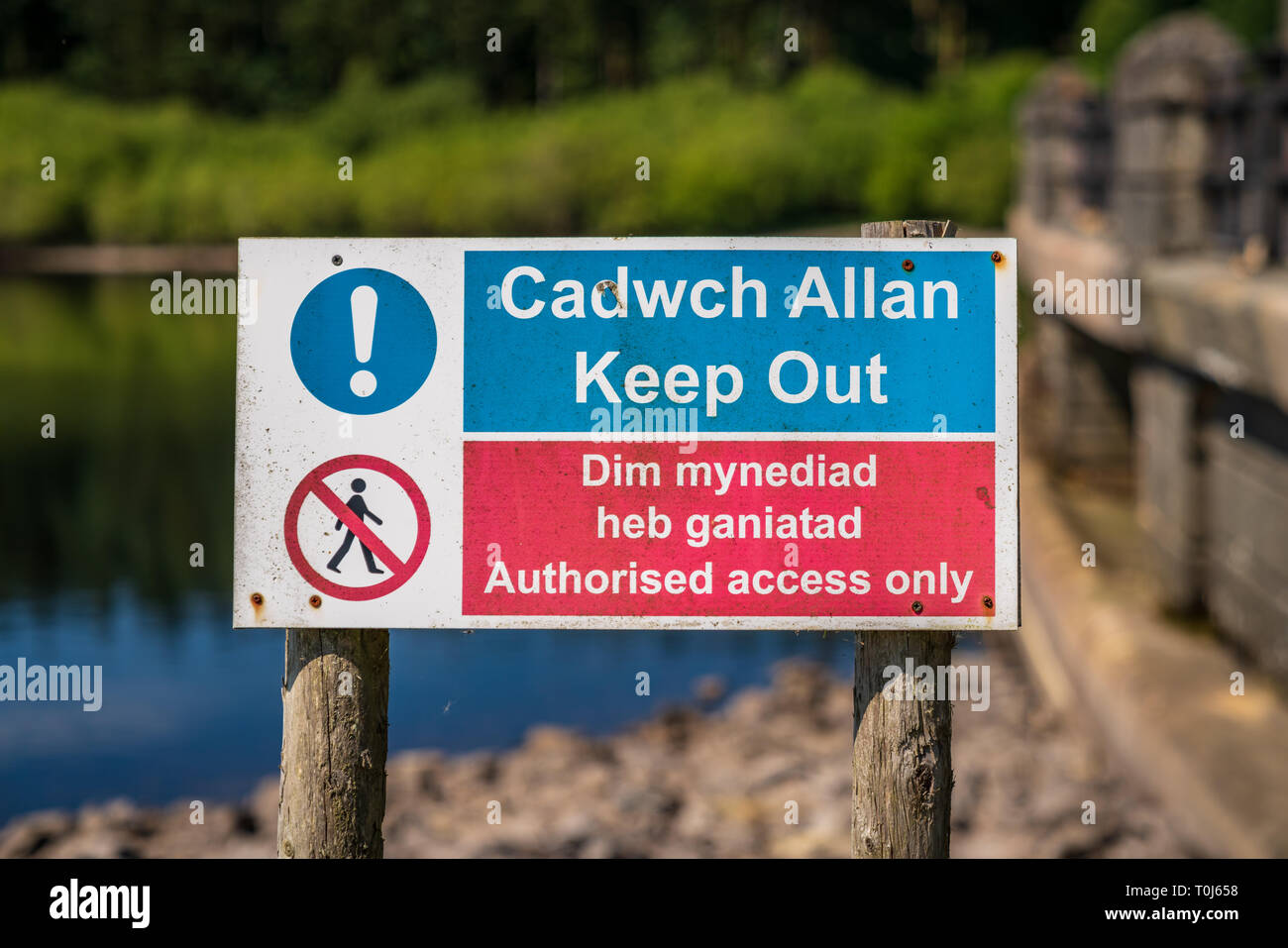 Sign: Keep out, authorised access only (Welsh & English), seen at the ...