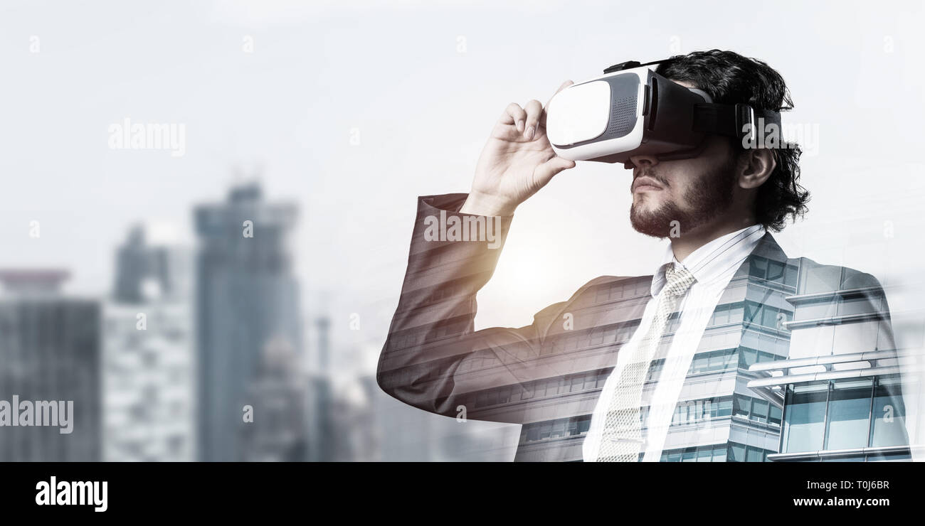 Handsome elegant businessman experiencing impressive virtual reality ...