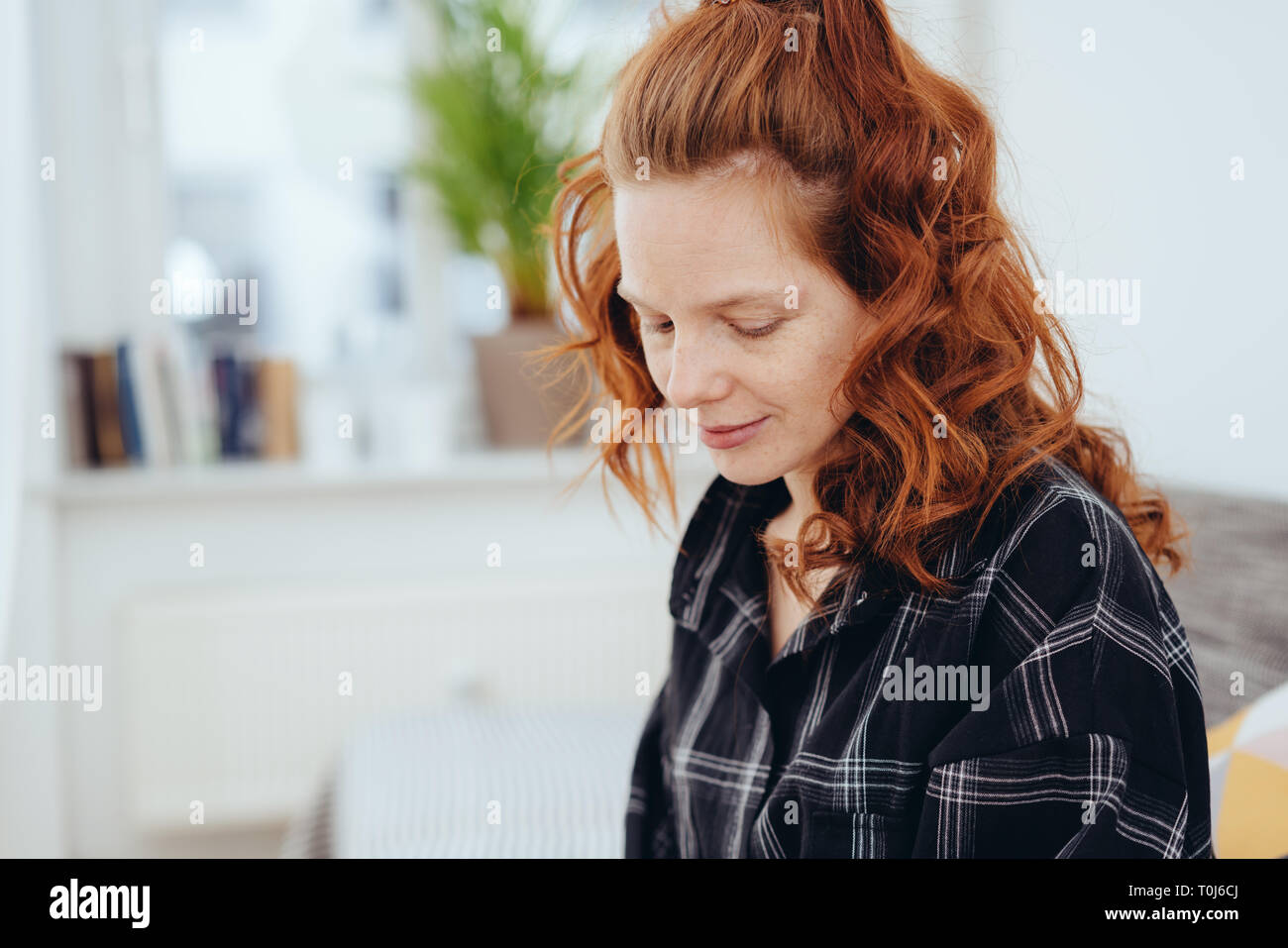 Woman with downcast eyes hi-res stock photography and images - Alamy