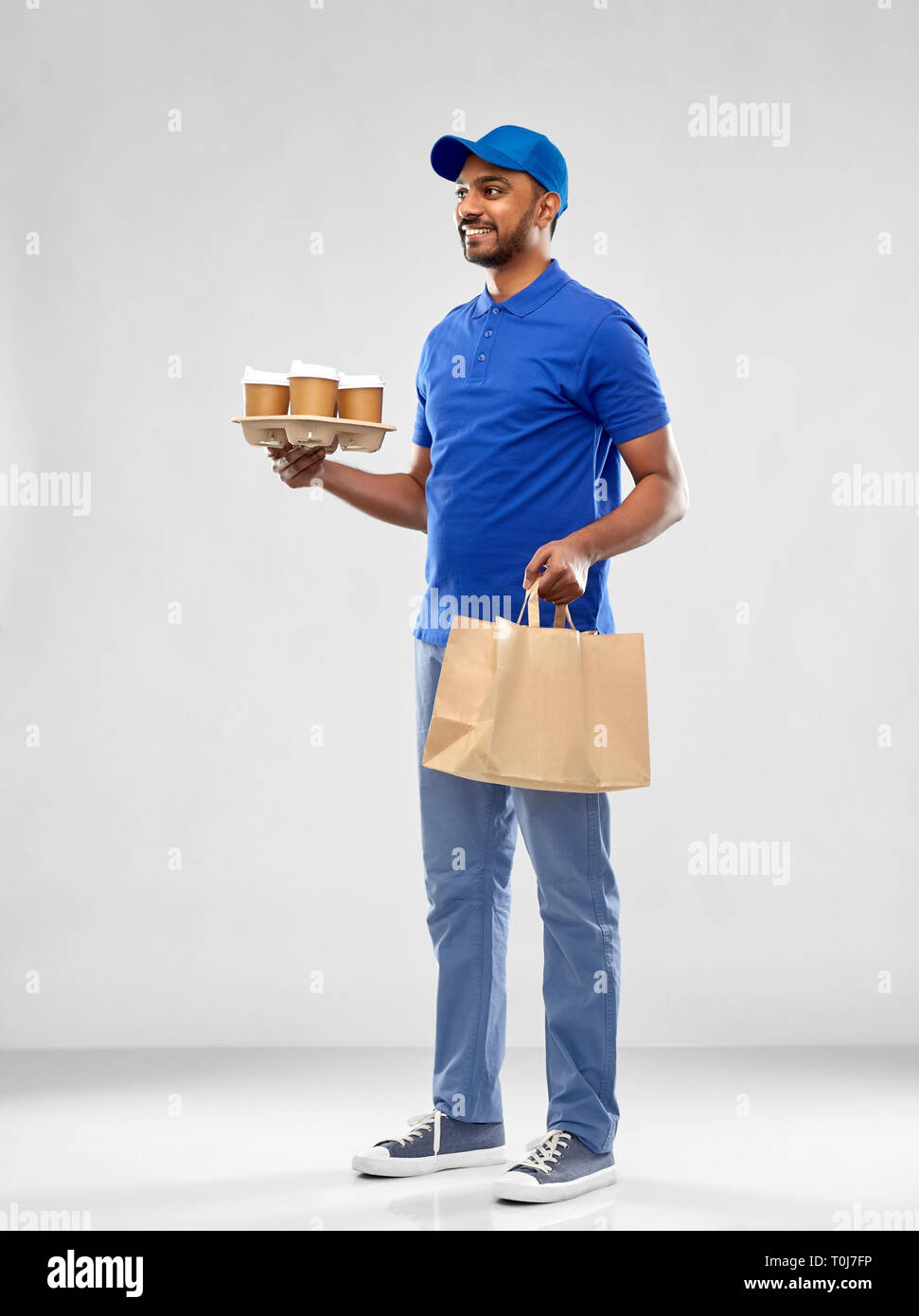 happy indian delivery man with food and drinks Stock Photo - Alamy