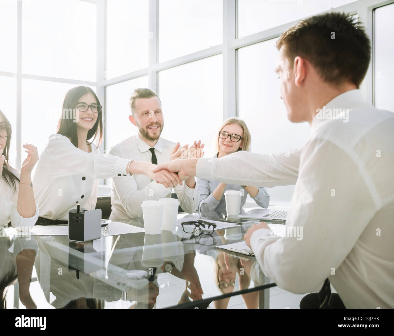 HR Manager shaking hands with new employee Stock Photo - Alamy