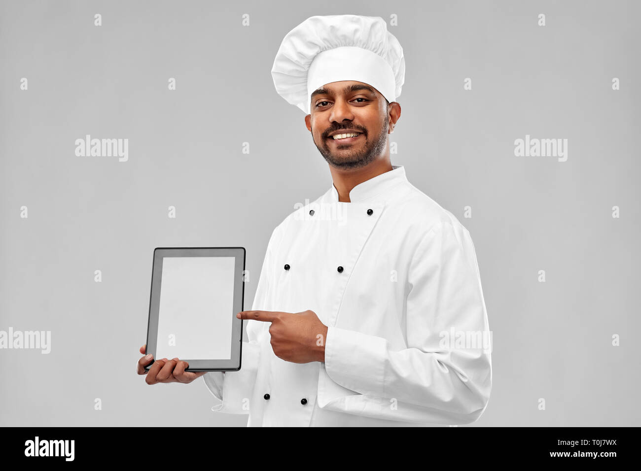 happy male indian chef with tablet computer Stock Photo - Alamy