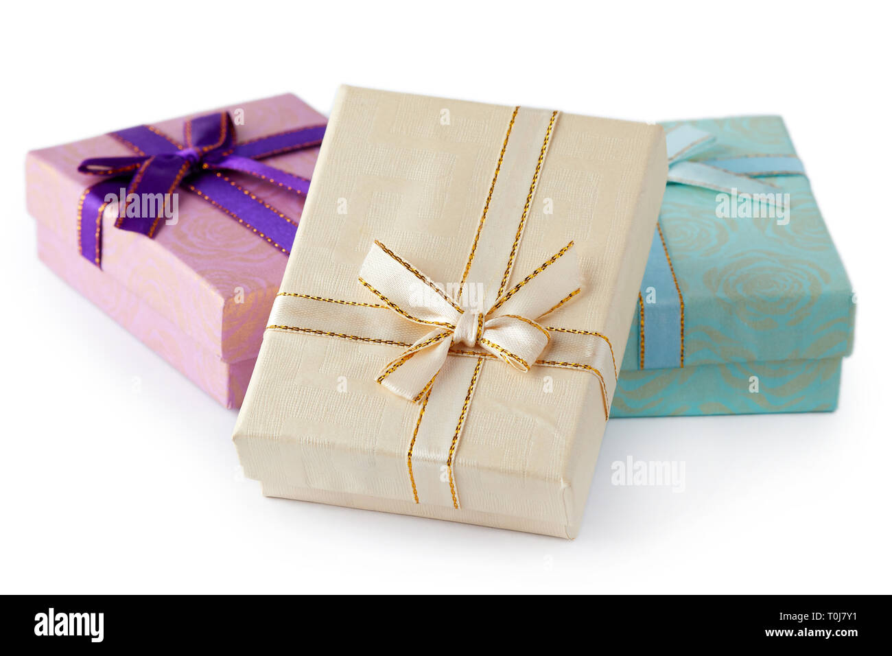 Three gift boxes with bow isolated on white background Stock Photo - Alamy