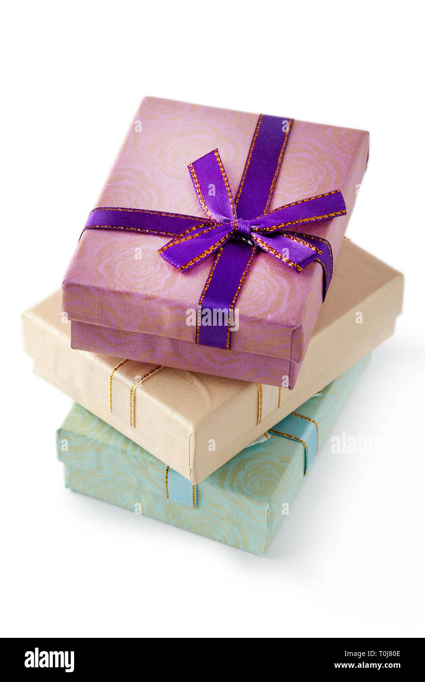 Three gift boxes with bow isolated on white background Stock Photo - Alamy