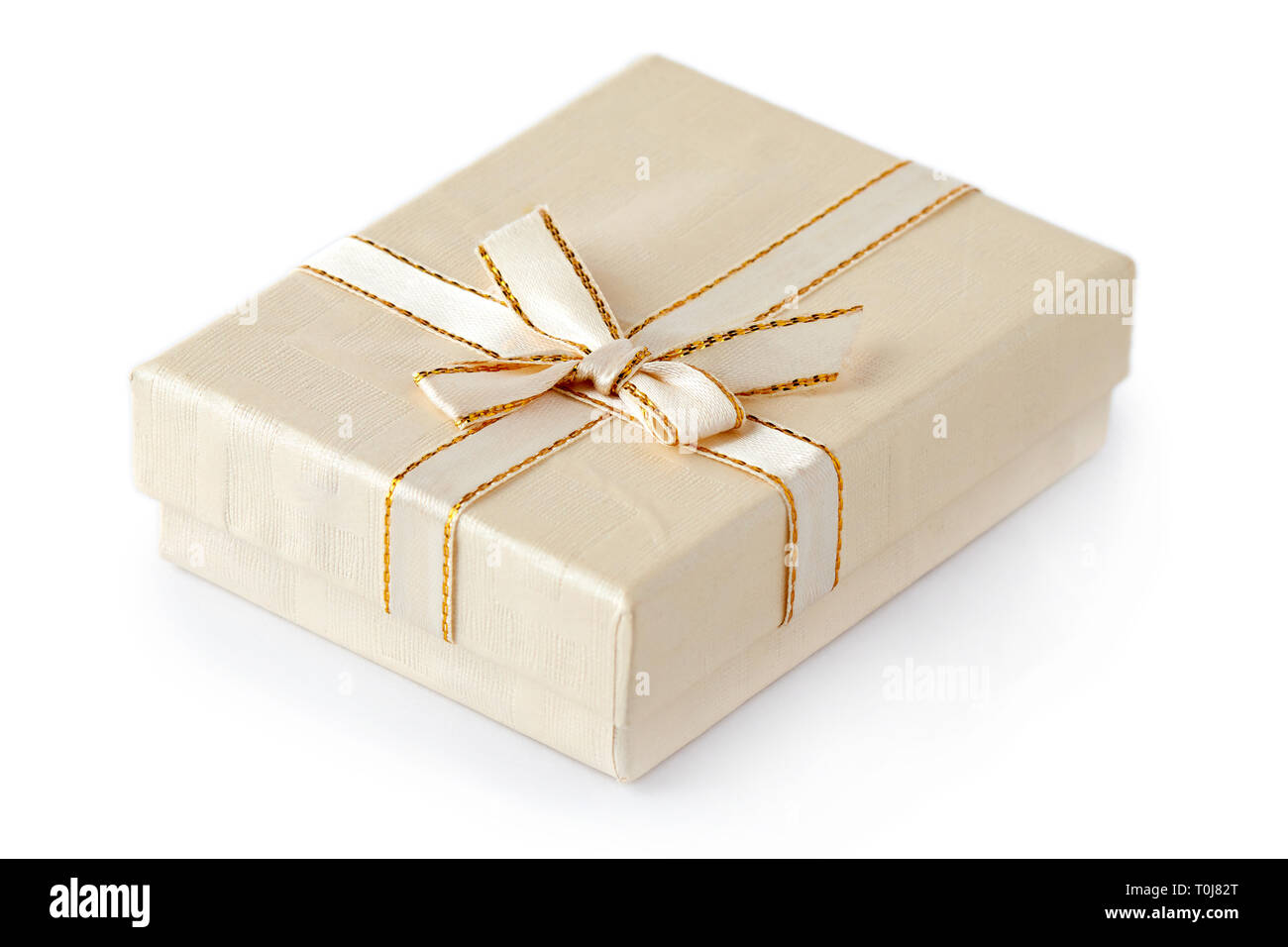Beige gift box with bow isolated on white background Stock Photo - Alamy