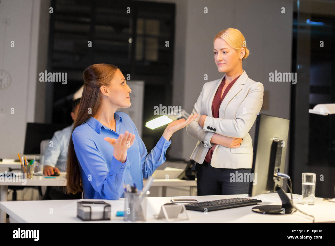 businesswomen with computer working late at office Stock Photo - Alamy