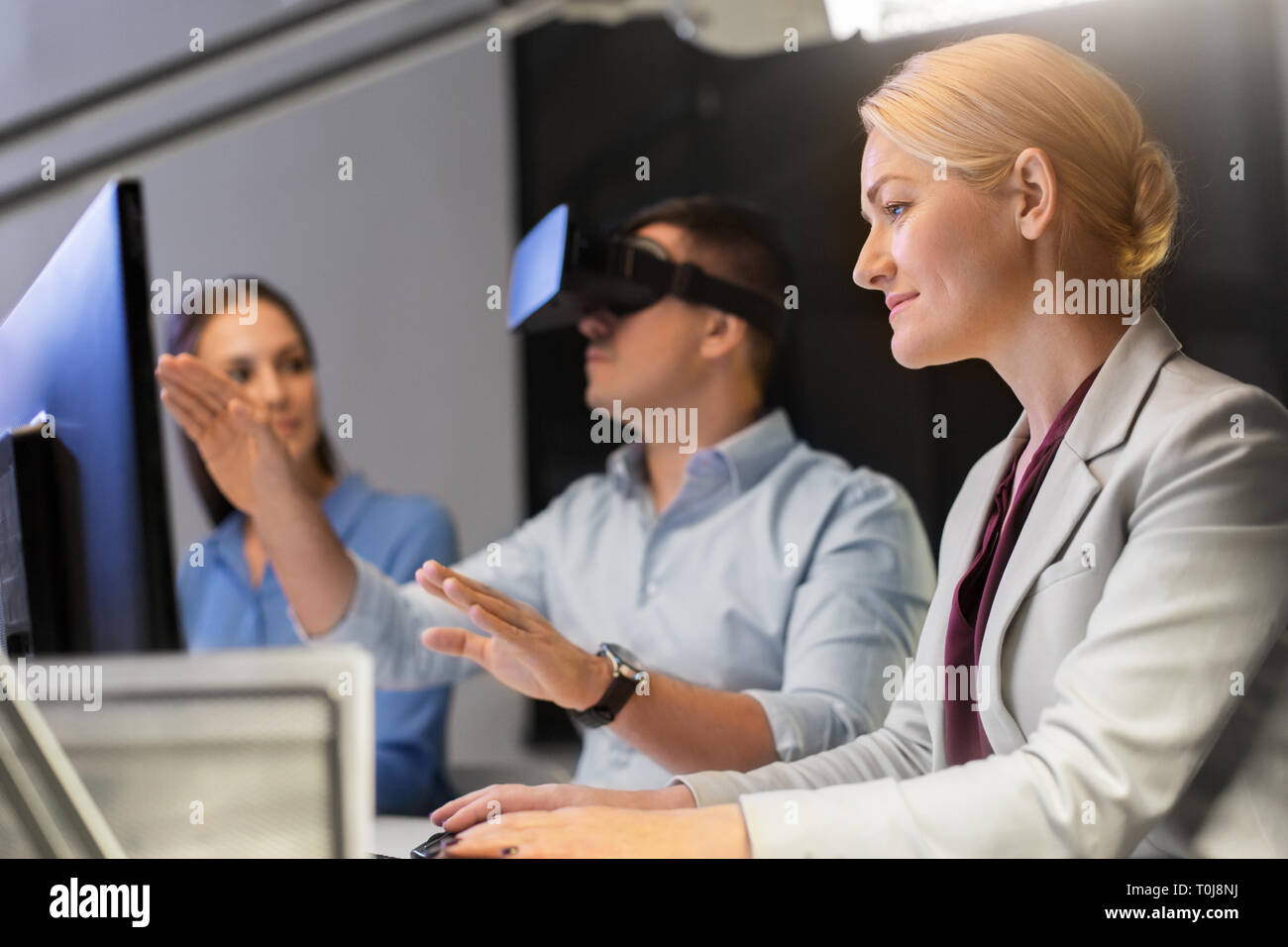 business team with computer working late at office Stock Photo - Alamy