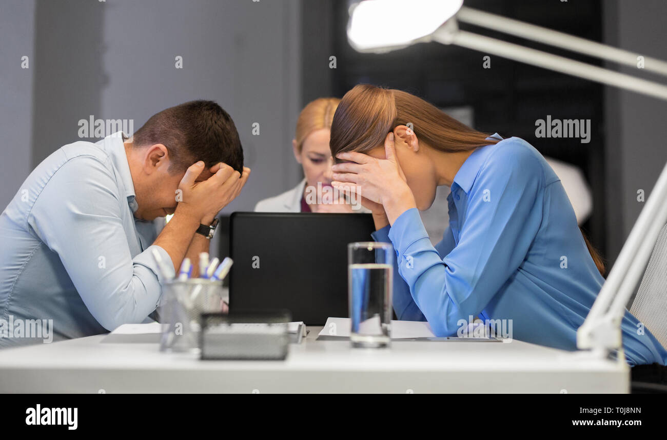business team with laptop working late at office Stock Photo - Alamy