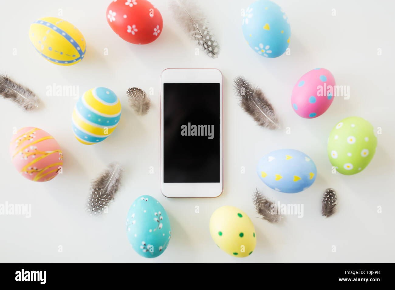 smartphone with easter eggs and quail feathers Stock Photo - Alamy
