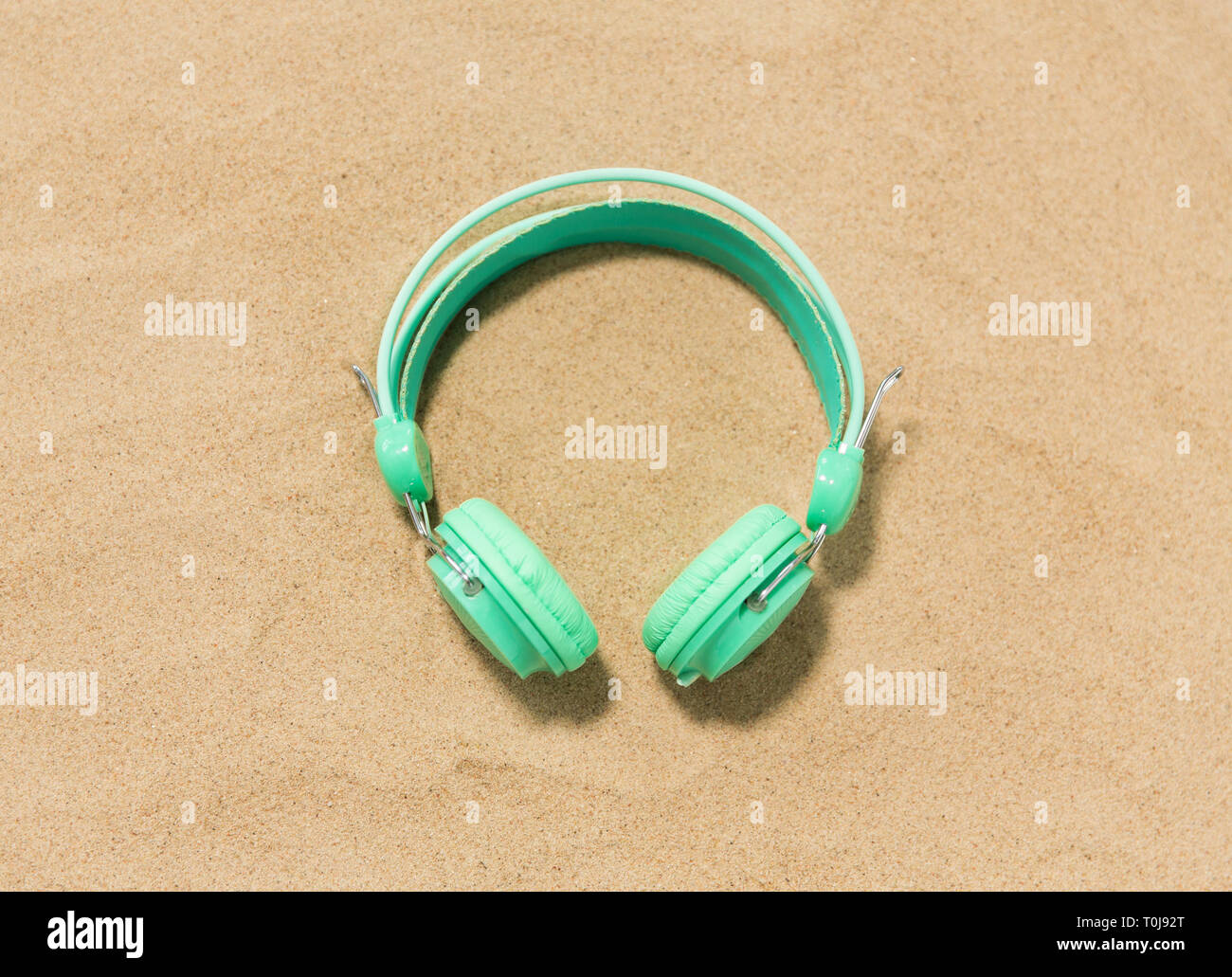earphones on summer beach sand Stock Photo - Alamy