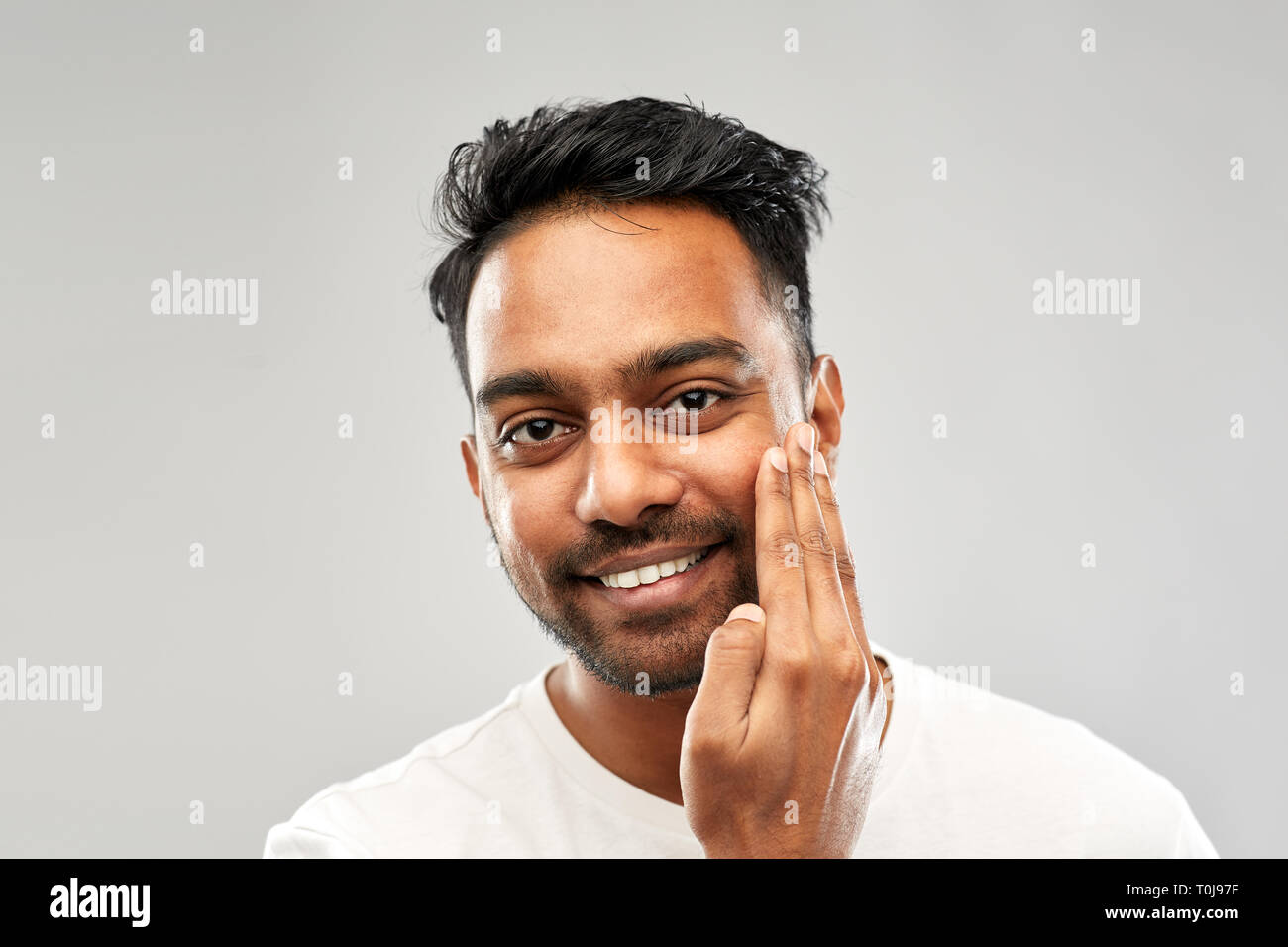 smiling indian man touching his beard Stock Photo - Alamy smiling indian man touching his beard Stock Photo - Alamy