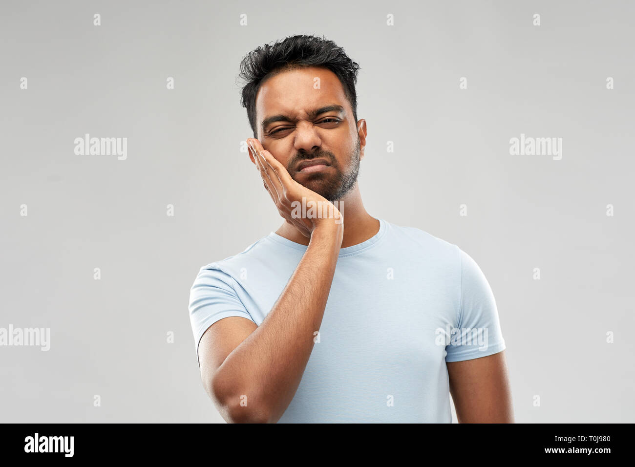 indian man suffering from toothache Stock Photo - Alamy