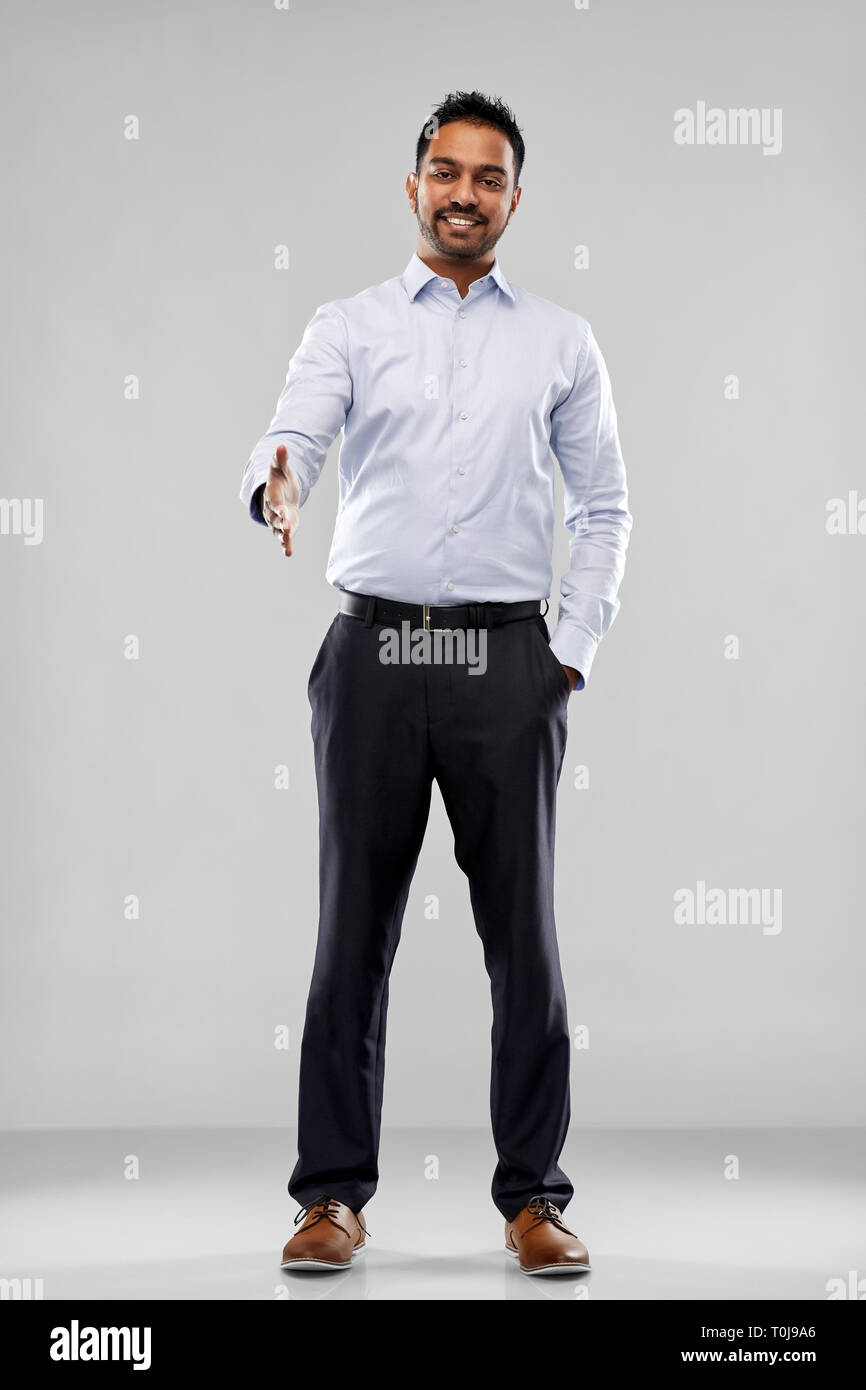 indian businessman stretching hand for handshake Stock Photo - Alamy