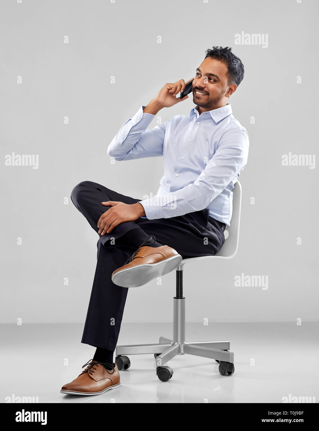 South indian businessman sitting on hi-res stock photography and images ...