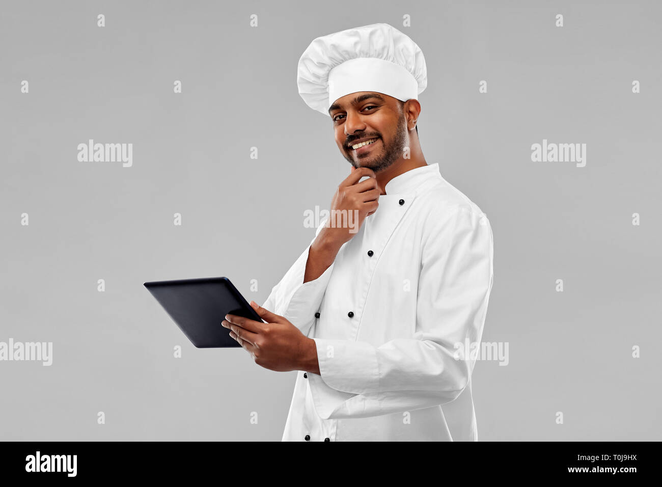 happy male indian chef with tablet computer Stock Photo - Alamy