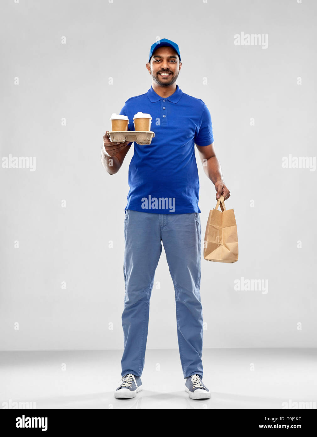 happy indian delivery man with food and drinks Stock Photo - Alamy