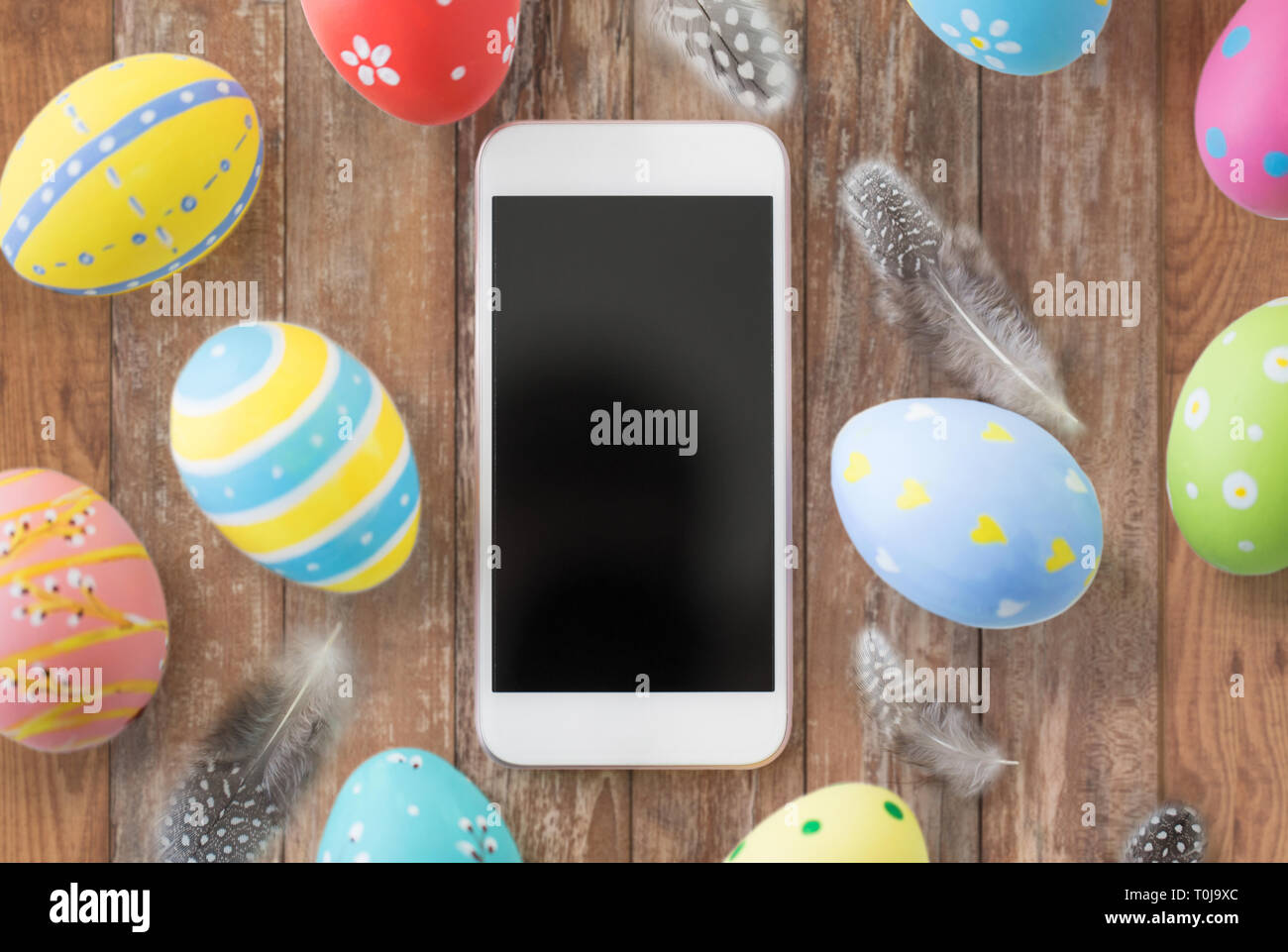 smartphone with easter eggs and quail feathers Stock Photo - Alamy