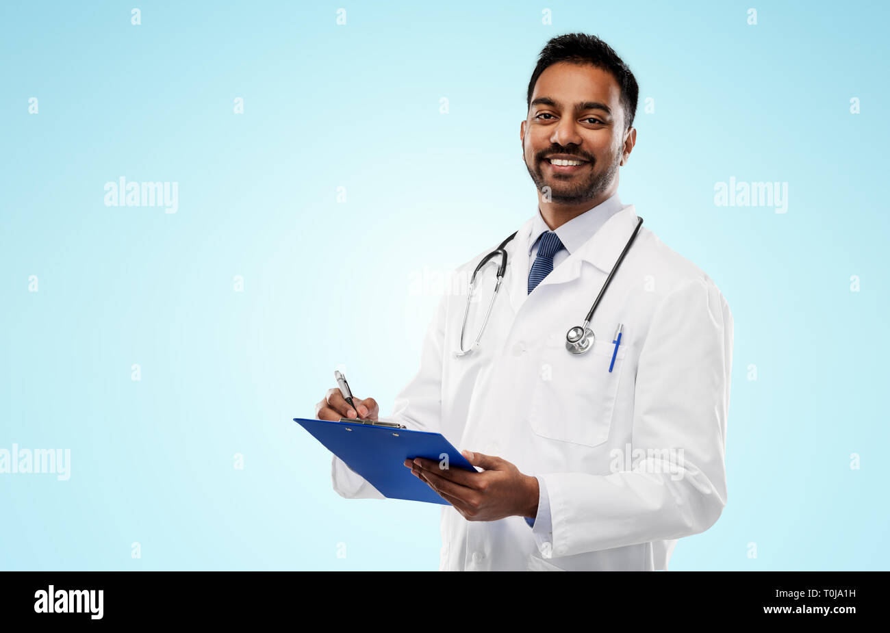 Indian doctor writing hi-res stock photography and images - Alamy