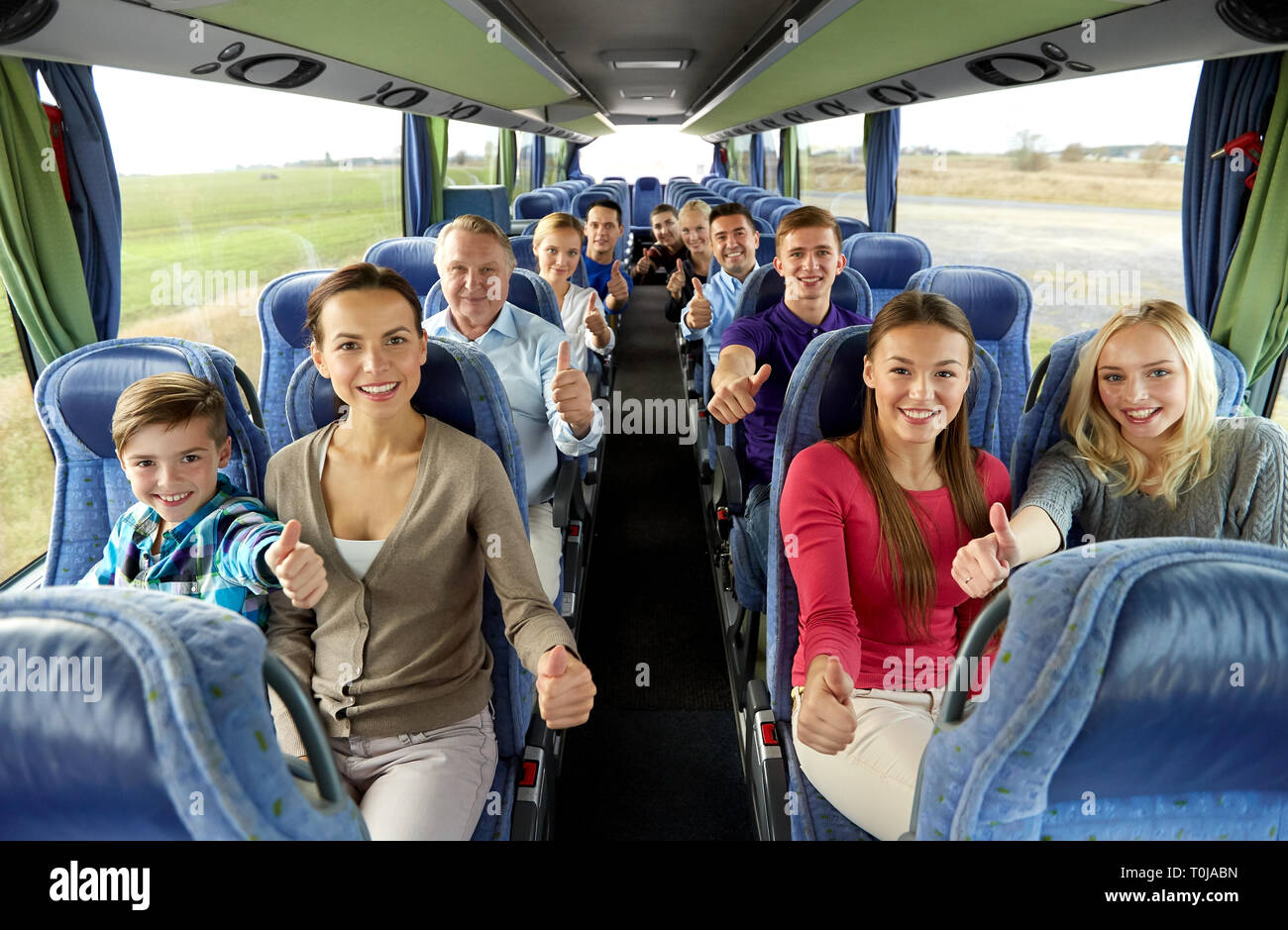 group of happy passengers travelling by bus Stock Photo - Alamy