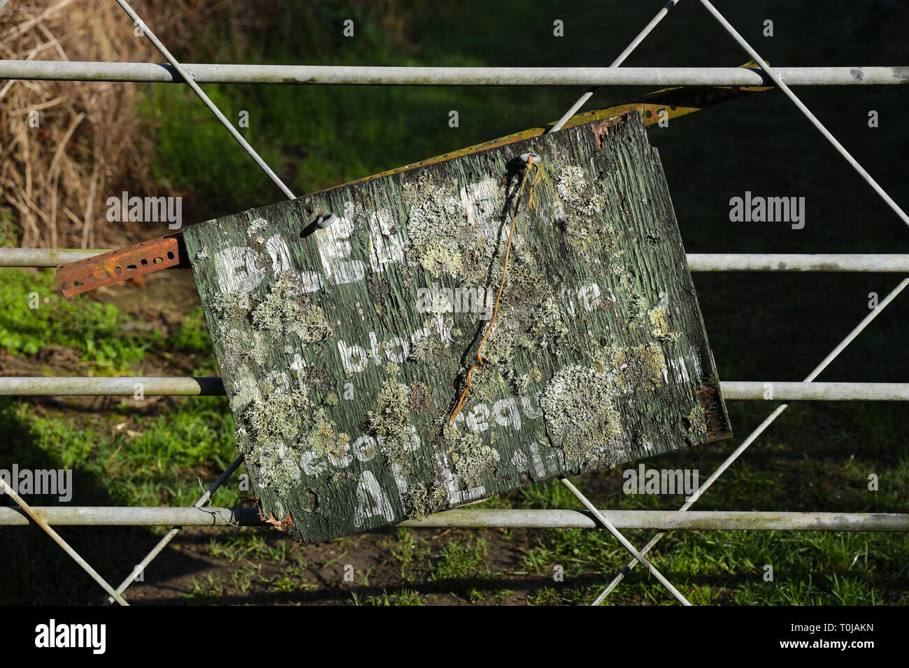 Old sign on gate Stock Photo - Alamy