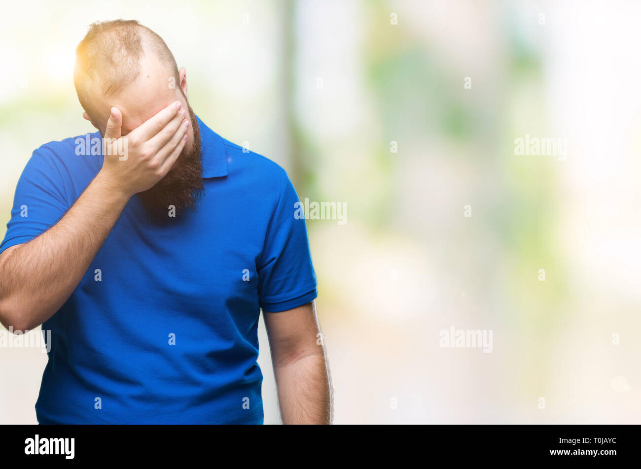 Young caucasian hipster man wearing blue shirt over isolated background ...