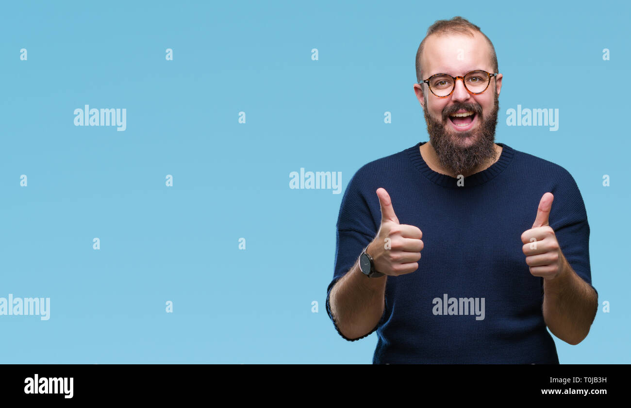 Young caucasian hipster man wearing sunglasses over isolated background ...