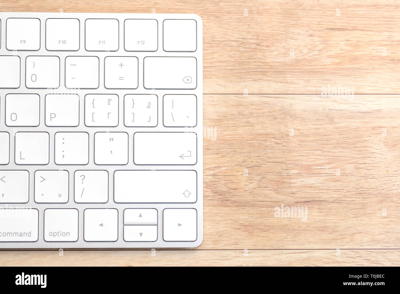 View from above at the computer on the wooden desk Stock Photo - Alamy