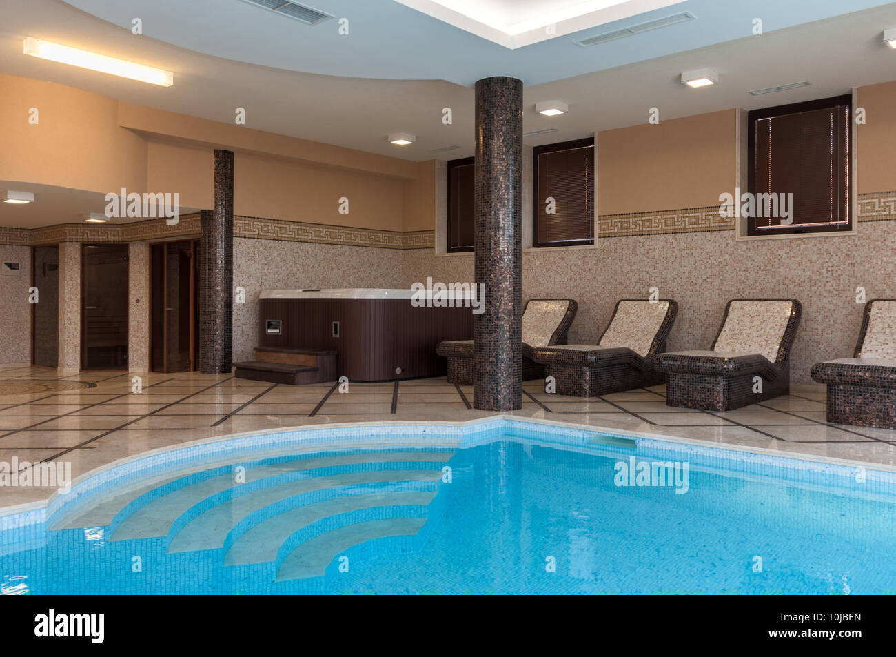 Marble home spa interior with indoor swimming pool in modern ...