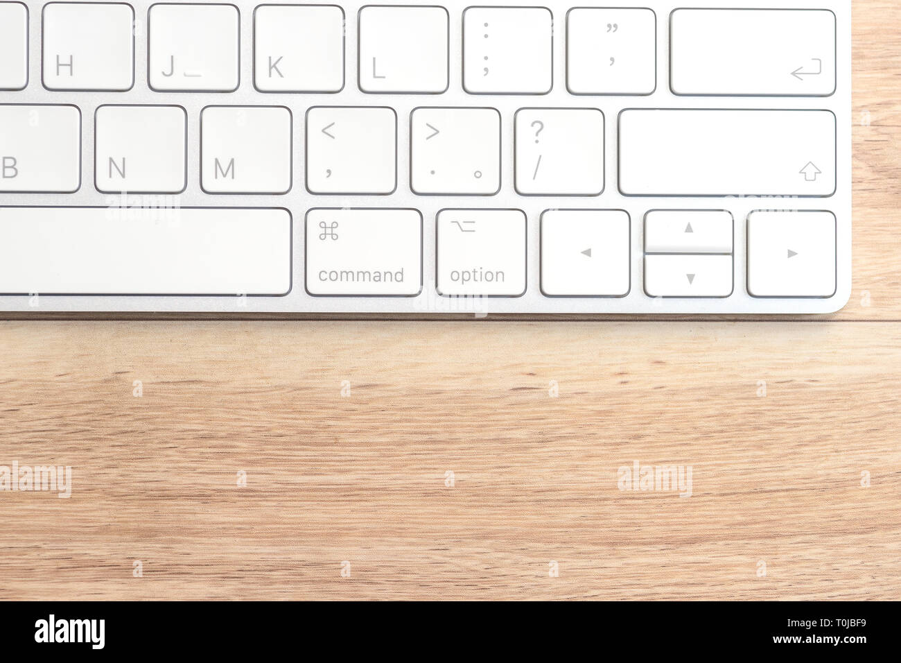 View from above at the computer on the wooden desk Stock Photo - Alamy