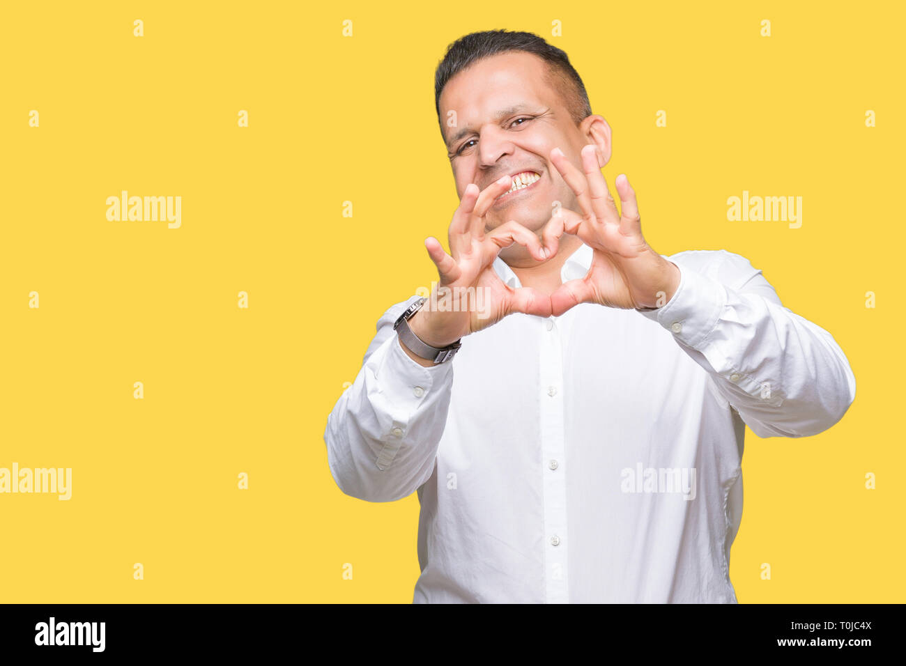 Middle age arab elegant man over isolated background smiling in love ...