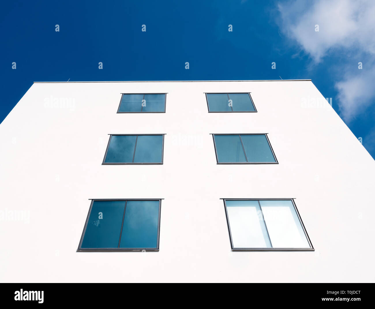 abstract rectangular forms of windows in white wall of modern office ...