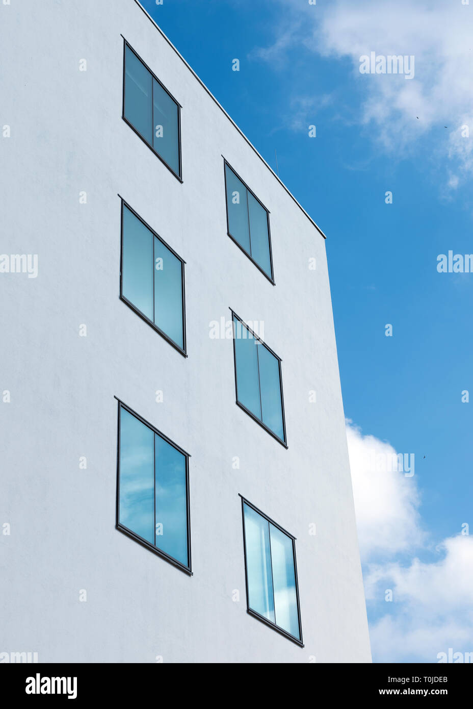abstract rectangular forms of windows in white wall of modern office ...