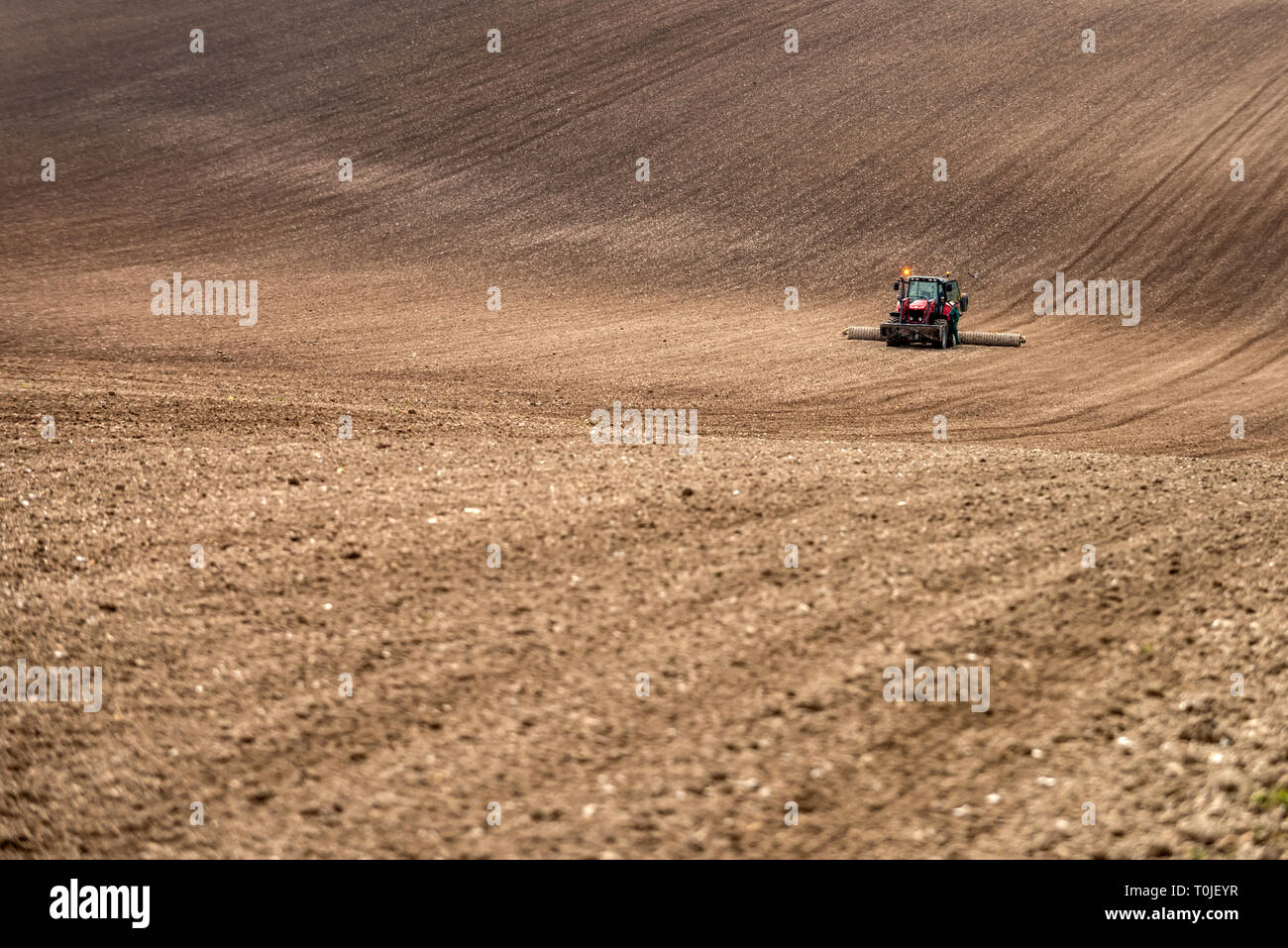 A farmer preparing his land for spring planting Stock Photo - Alamy