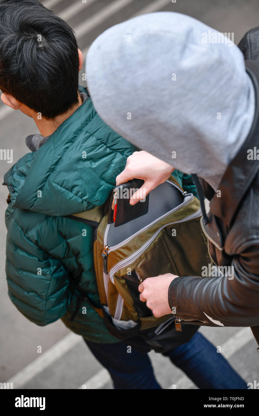 Theft of a change purse from a backpack, street criminal activity, put ...