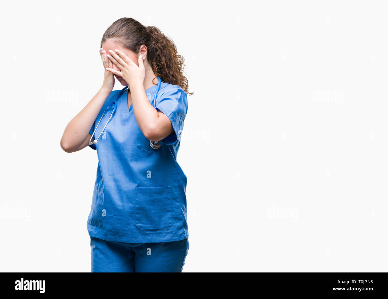 Young brunette doctor girl wearing nurse or surgeon uniform over ...