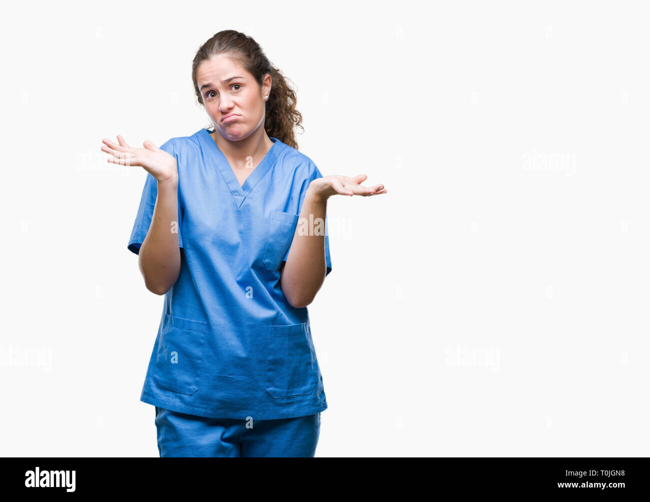 Young brunette doctor girl wearing nurse or surgeon uniform over ...