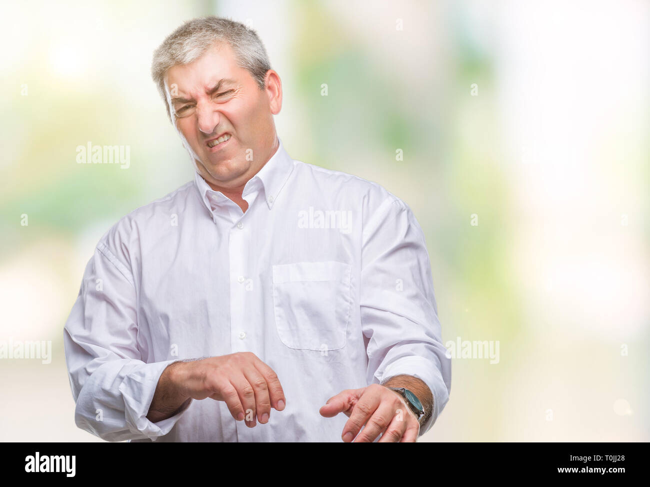 Handsome senior man over isolated background disgusted expression ...